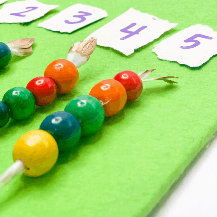 Bead Threading on Feathers Busy Bag - Views From a Step Stool